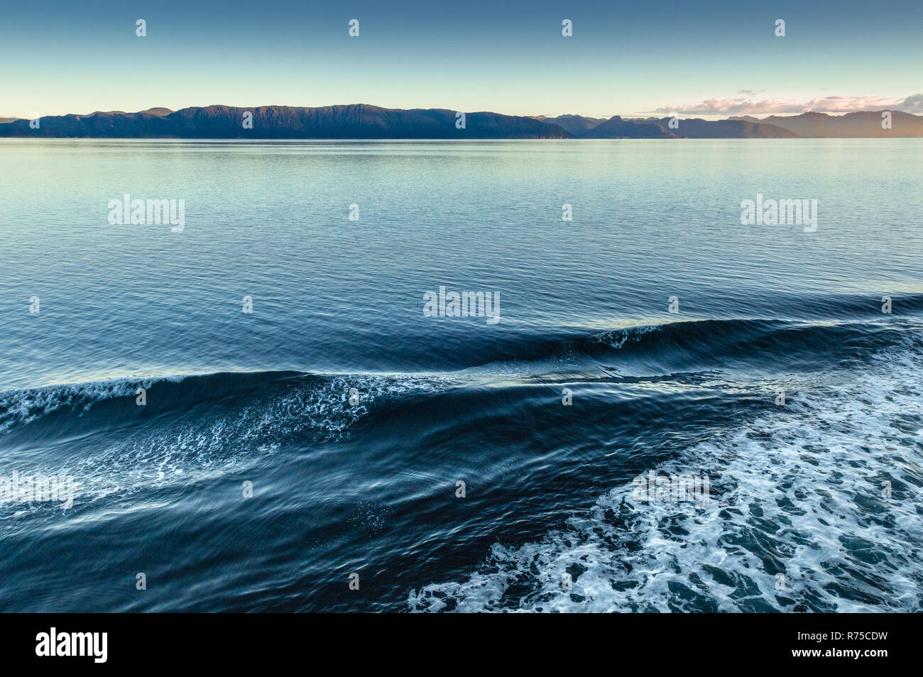 Ship bow wave ripples, Port side, in the quiet light of dawn with ...