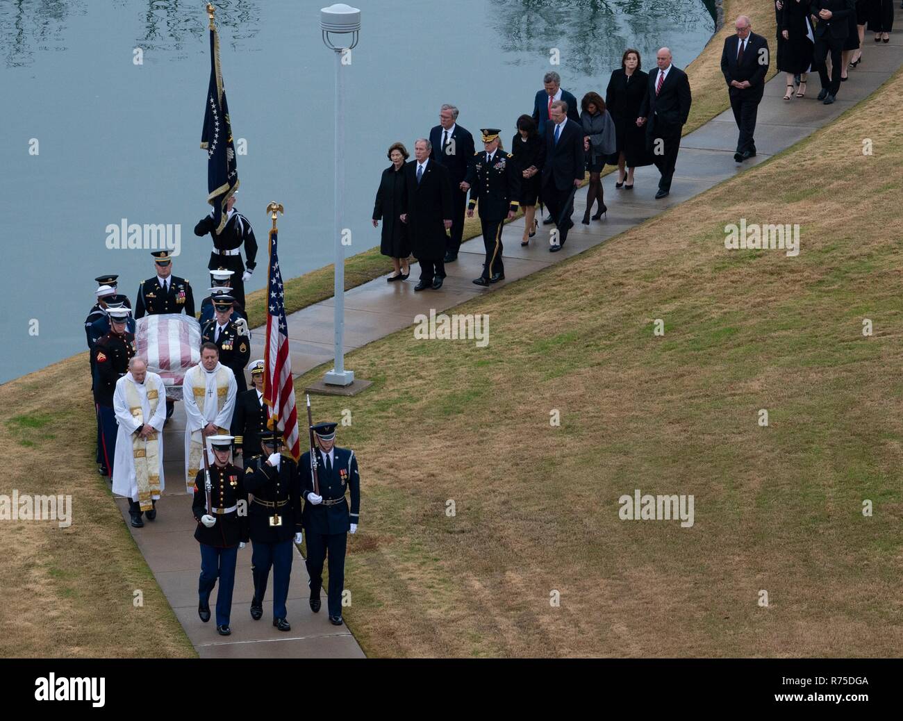 The flag draped casket of former president George H.W. Bush is carried ...