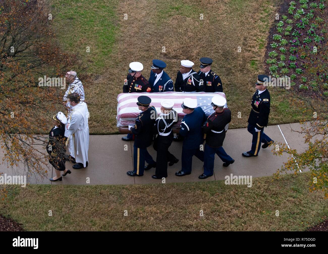 The flag draped casket of former president George H.W. Bush is carried ...