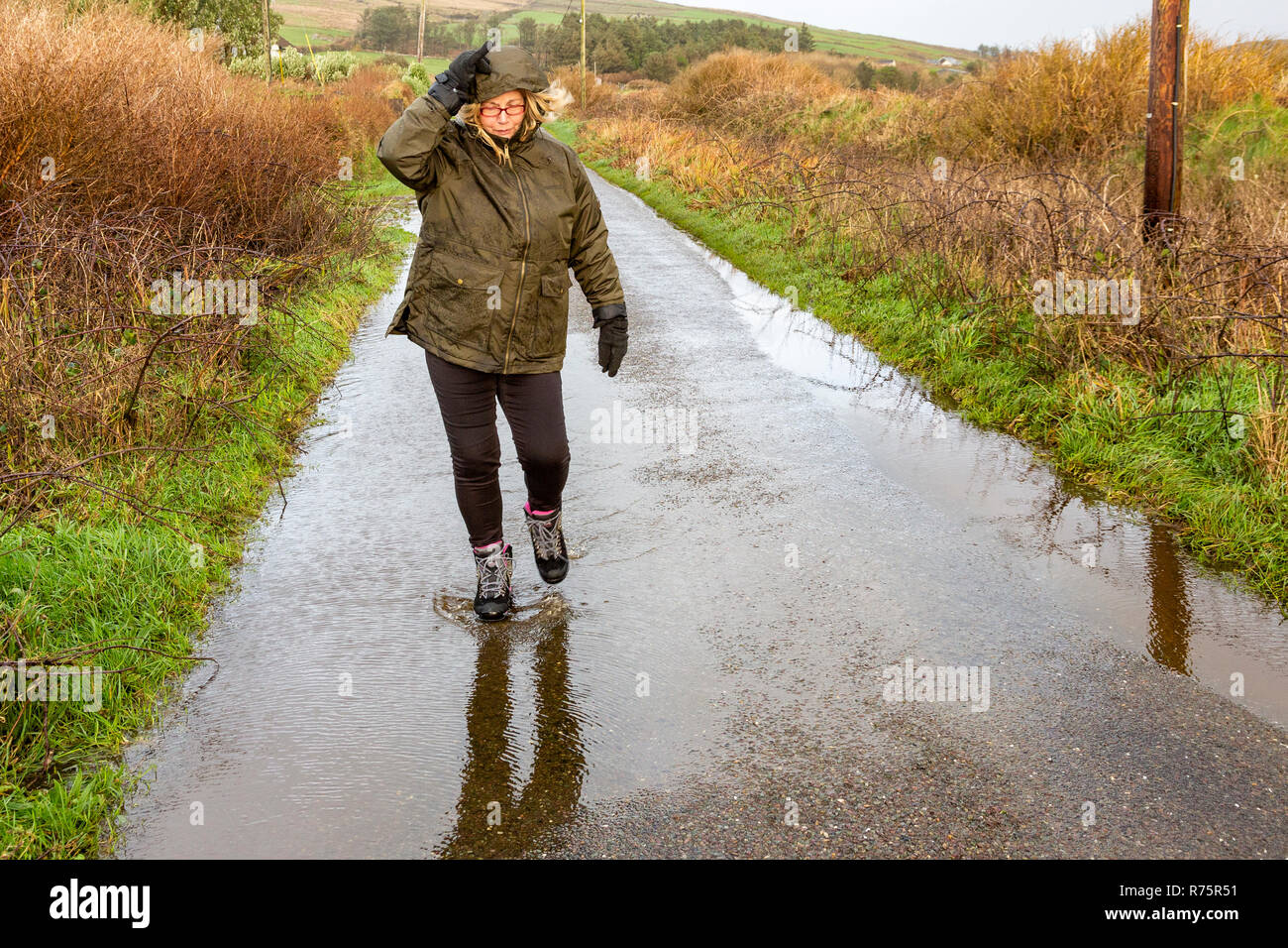 Woman getting wet in rain hi-res stock photography and images - Alamy
