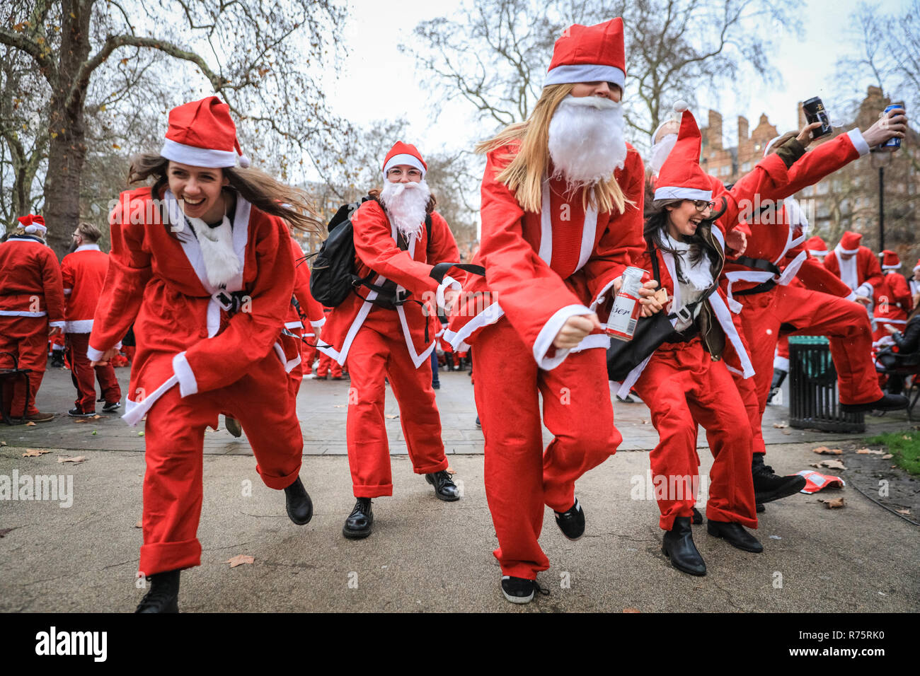 London, UK, 8th Dec 2018. Jumping Santas. Santa and his helpers having ...