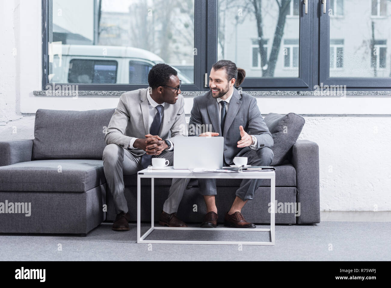 Multiethnic male business partners having hi-res stock photography and ...