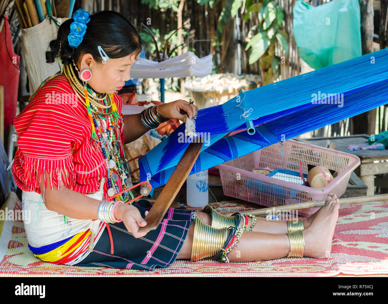 Kayaw woman weaving on a horizontal loom, Baan Tong Luang, Thailand ...