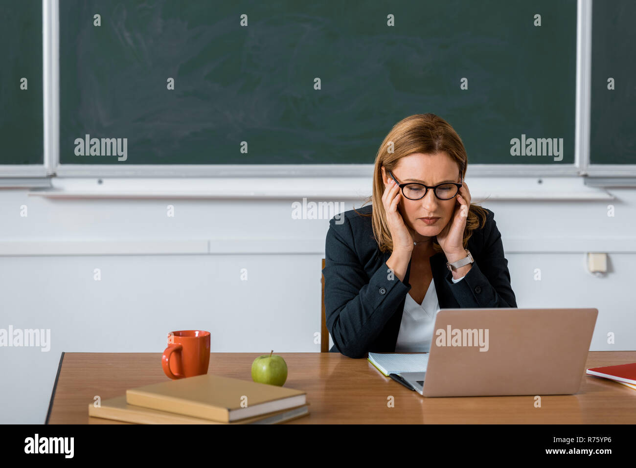 Stressed female teacher classroom hi-res stock photography and images ...