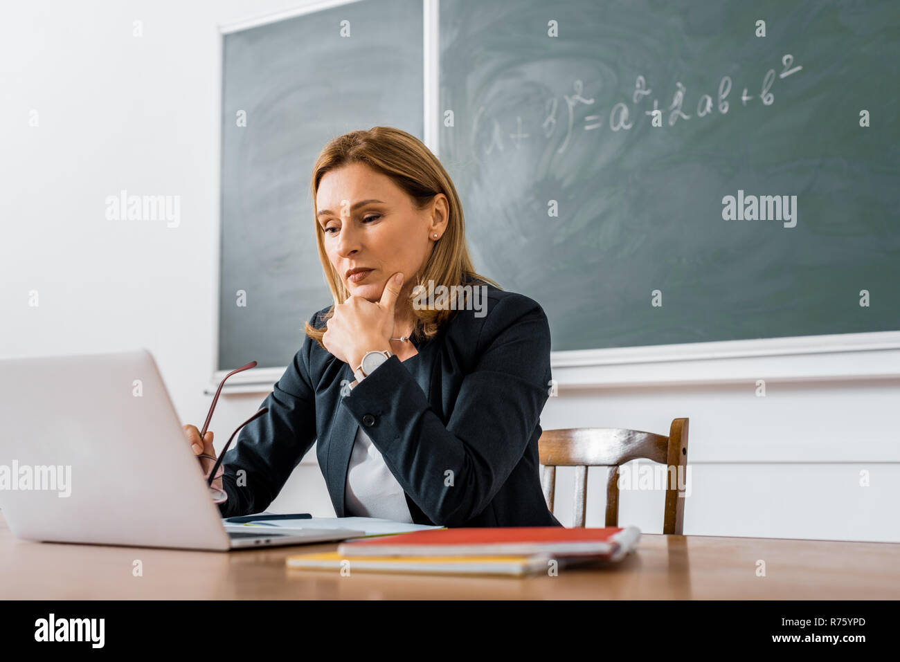 Teacher using laptop classroom hi-res stock photography and images - Alamy