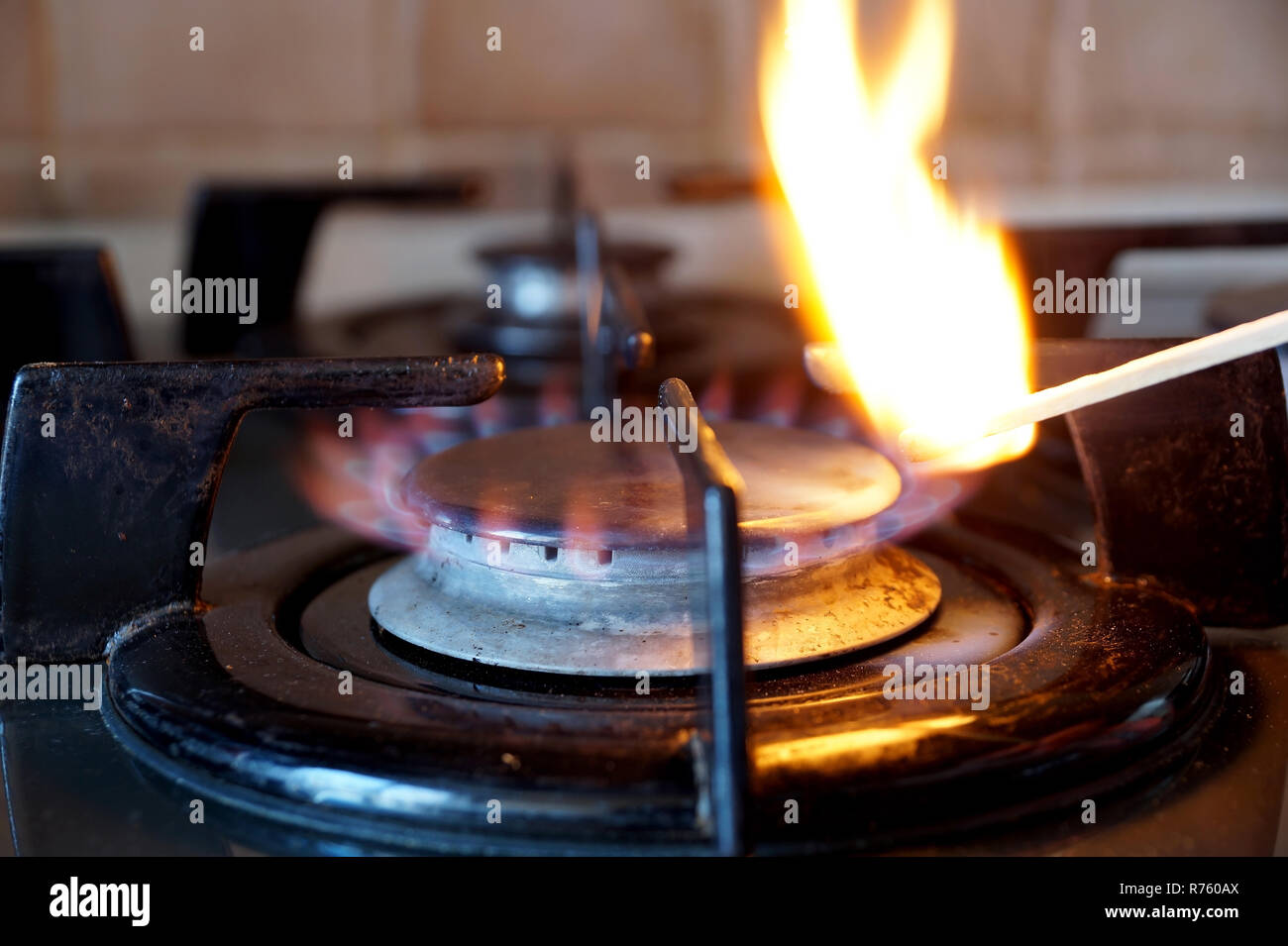 Ignition of a gas ring on the stove Stock Photo - Alamy