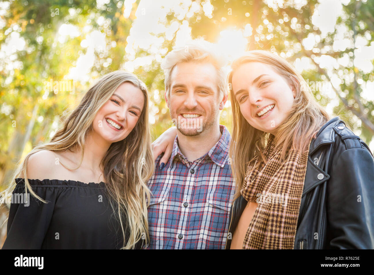 Three Brother and Sisters Portrait Outdoors Stock Photo - Alamy