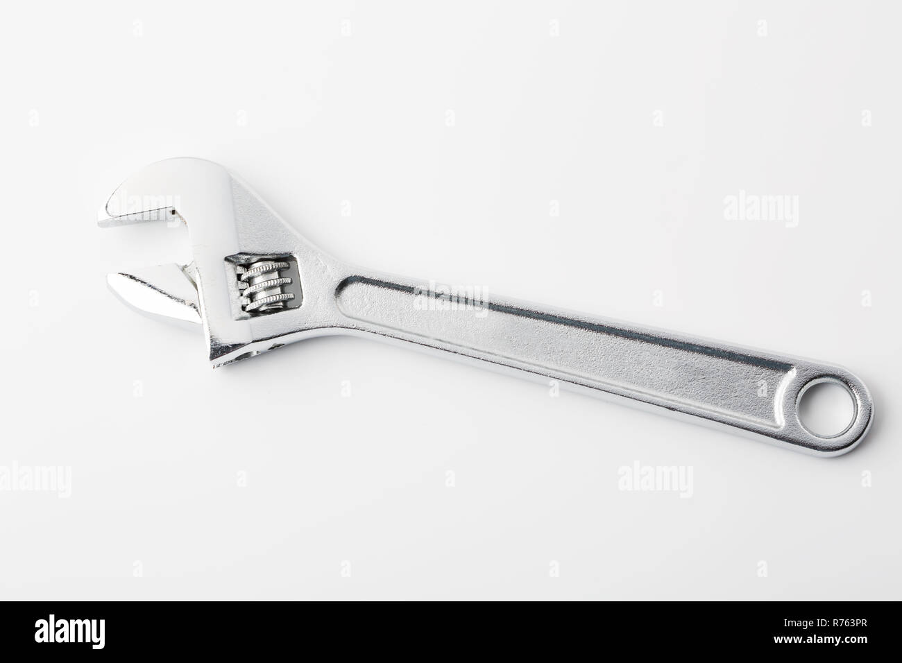 An adjustable crescent wrench tool on a white background Stock Photo ...