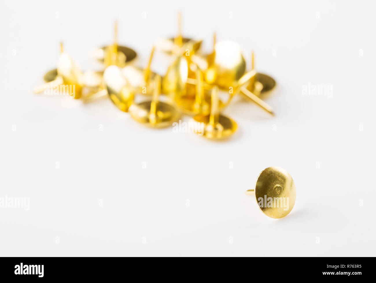 Closeup metal tacks on a white. Office concept Stock Photo - Alamy