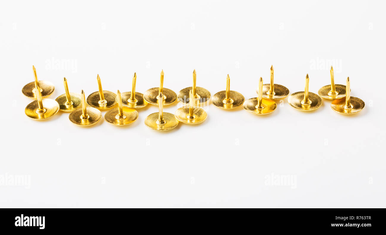 Closeup metal tacks on a white. Office concept Stock Photo - Alamy