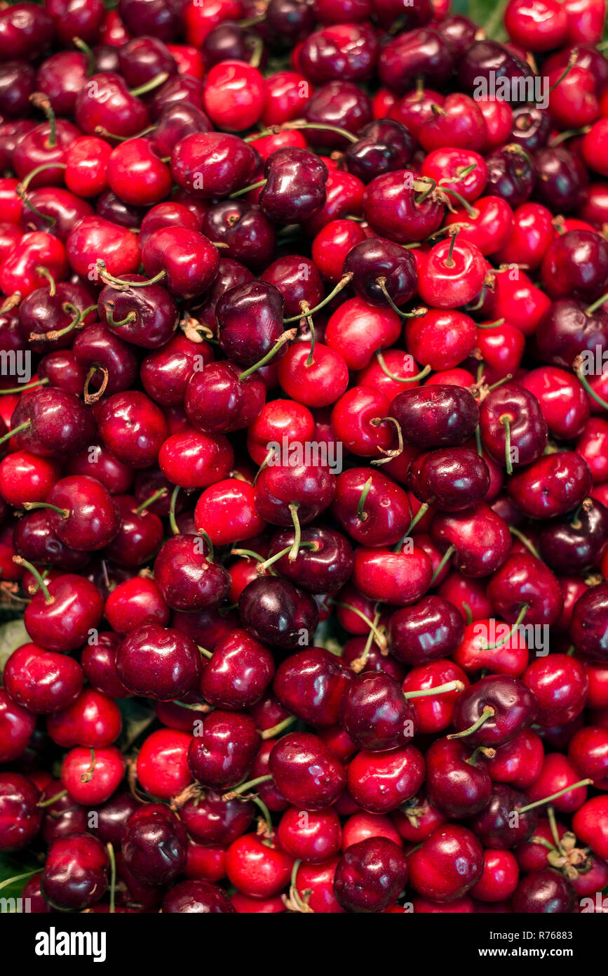 fresh organic red cherries on display Stock Photo - Alamy