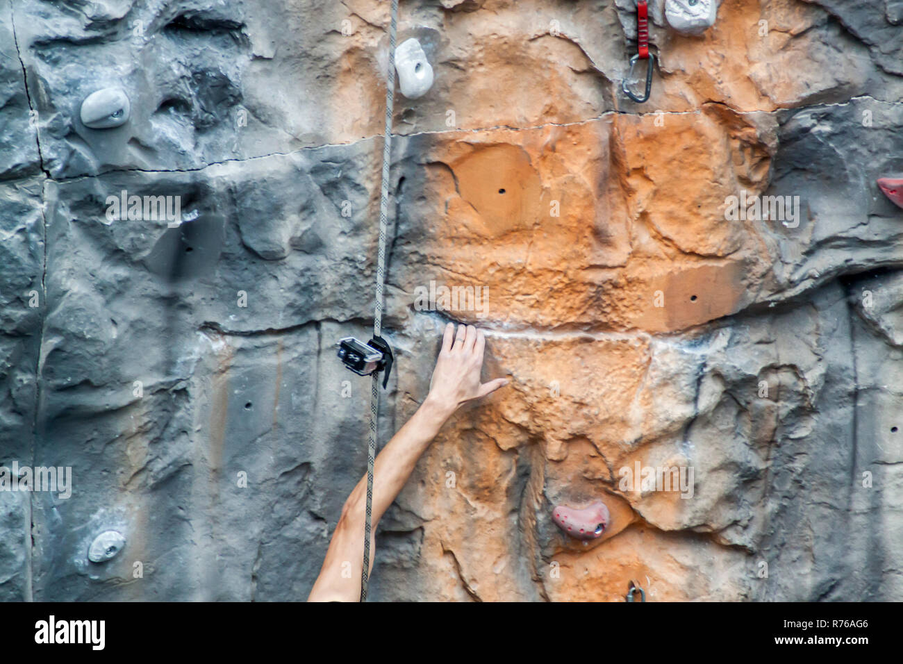 Human hand gripping on a climbing wall Stock Photo - Alamy