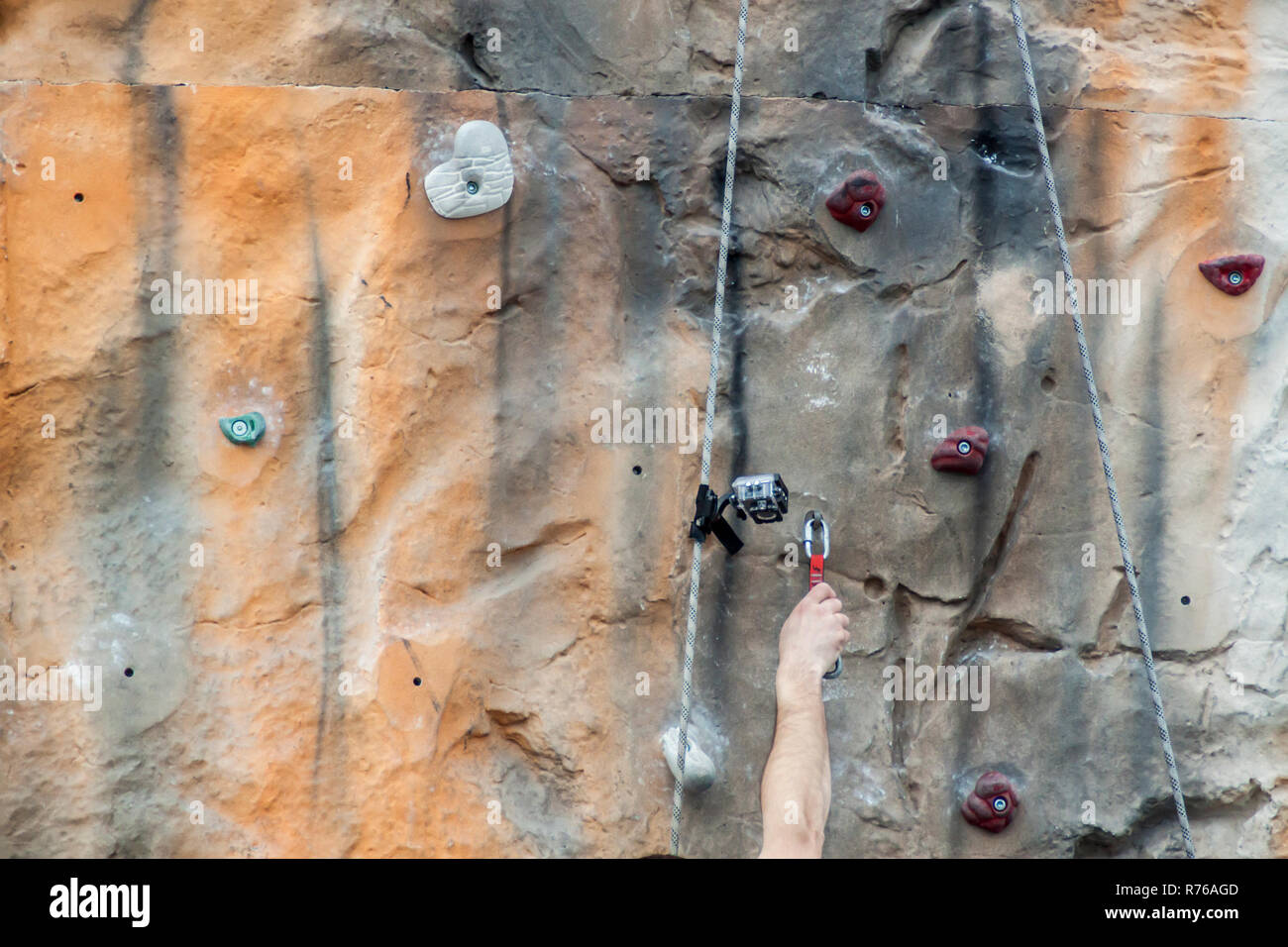 Human hand gripping on a climbing wall Stock Photo - Alamy