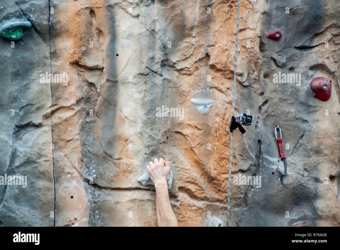 Human hand gripping on a climbing wall Stock Photo - Alamy