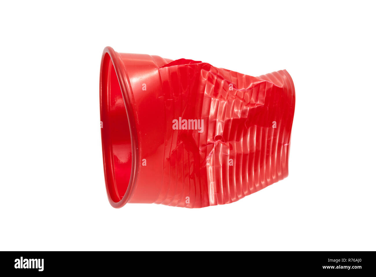 Crushed red plastic cup on a white background Stock Photo - Alamy