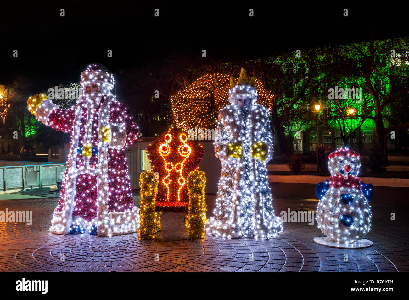 Santa Claus and Snow White statues decorated with lights Stock Photo ...