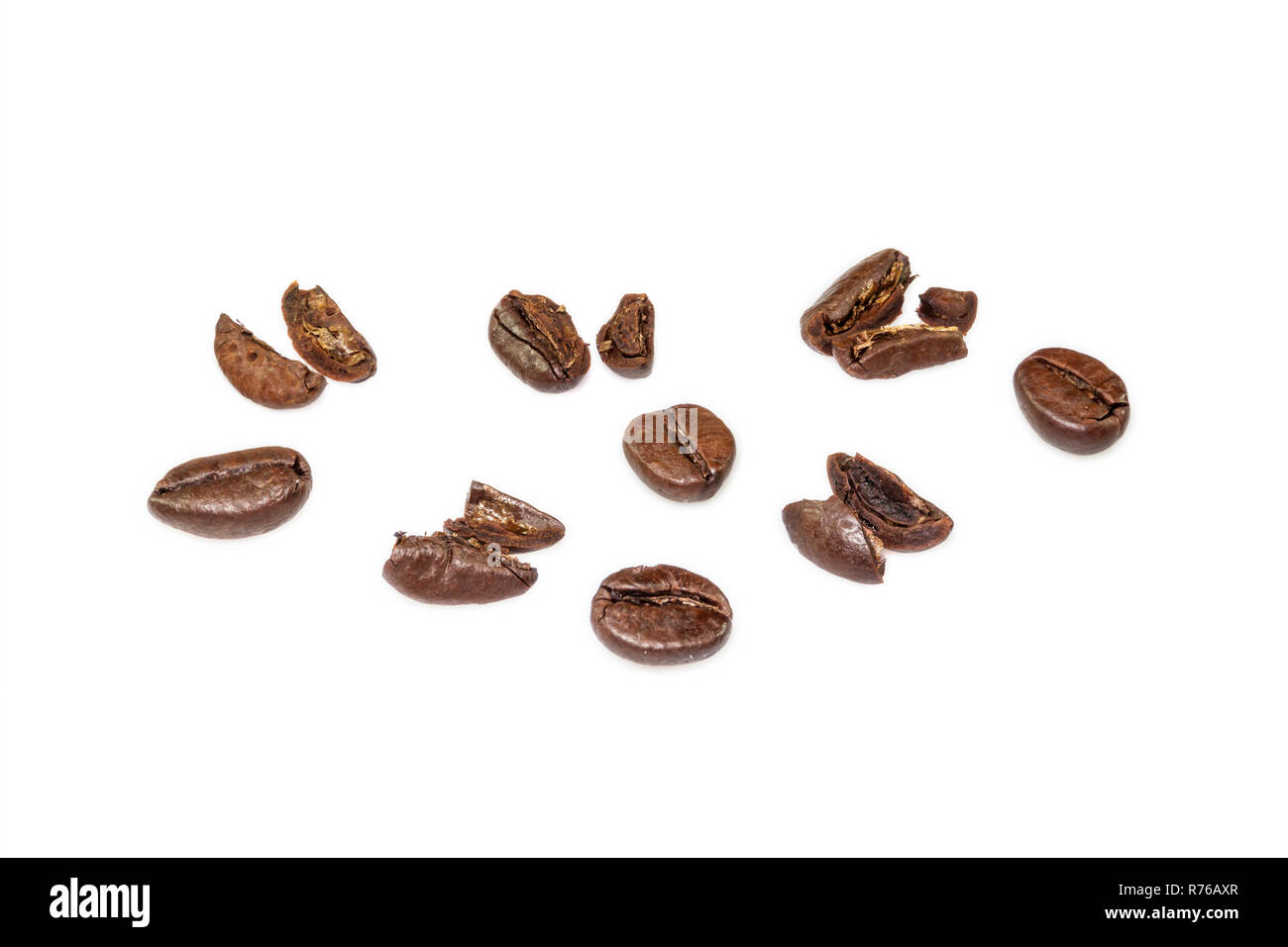 Whole and broken coffee beans isolated on white Stock Photo - Alamy