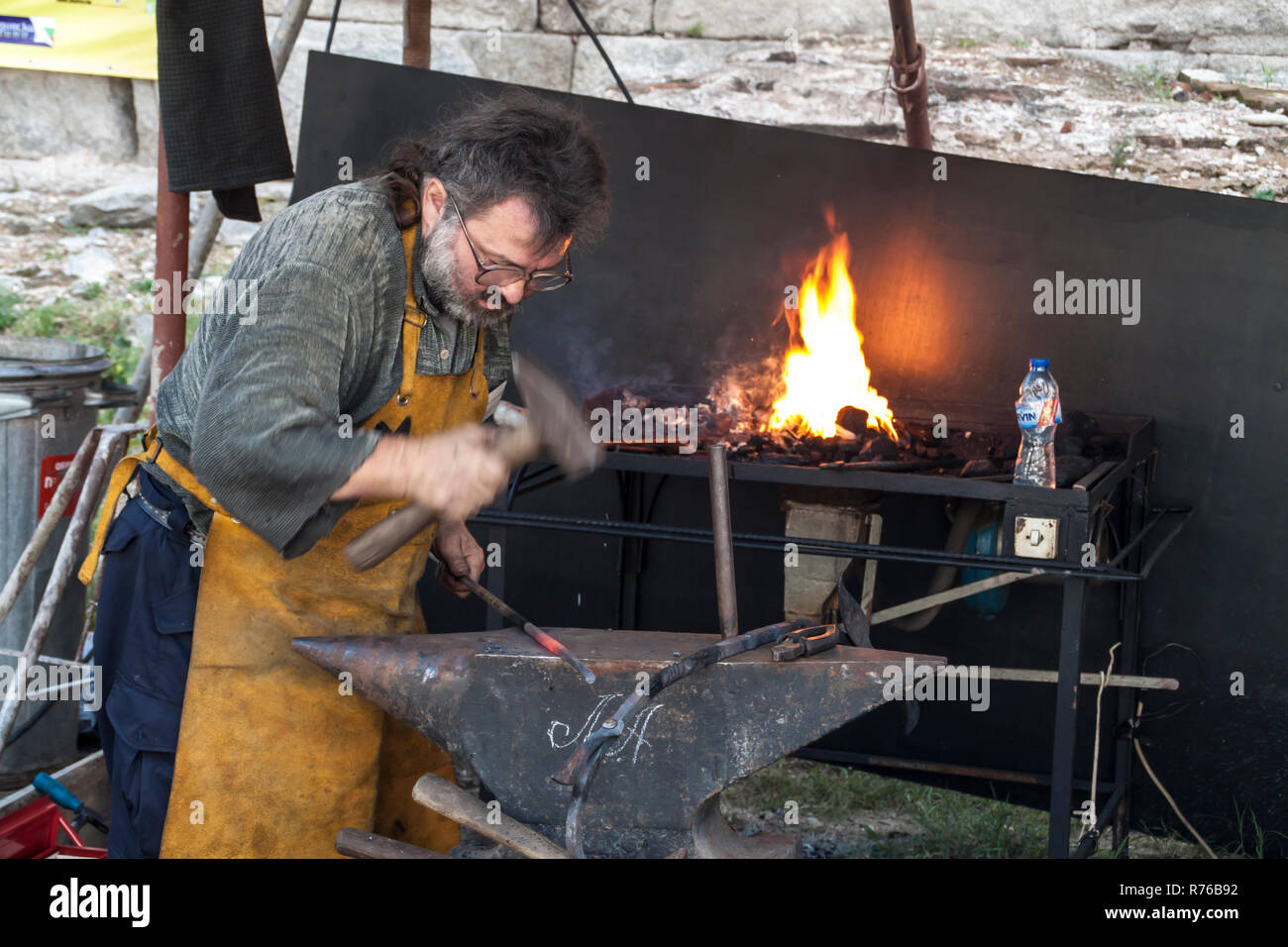 Blacksmith working on his next masterpiece Stock Photo - Alamy
