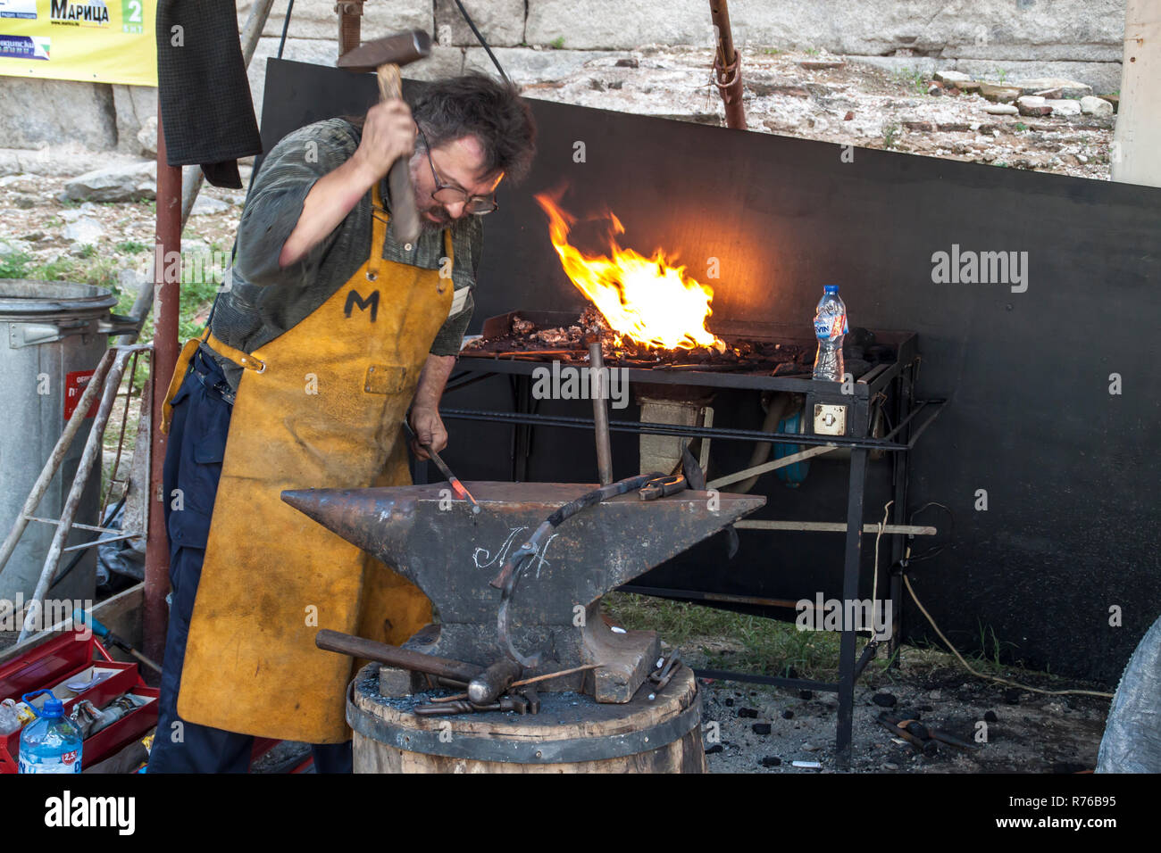 Blacksmith working on his next masterpiece Stock Photo - Alamy