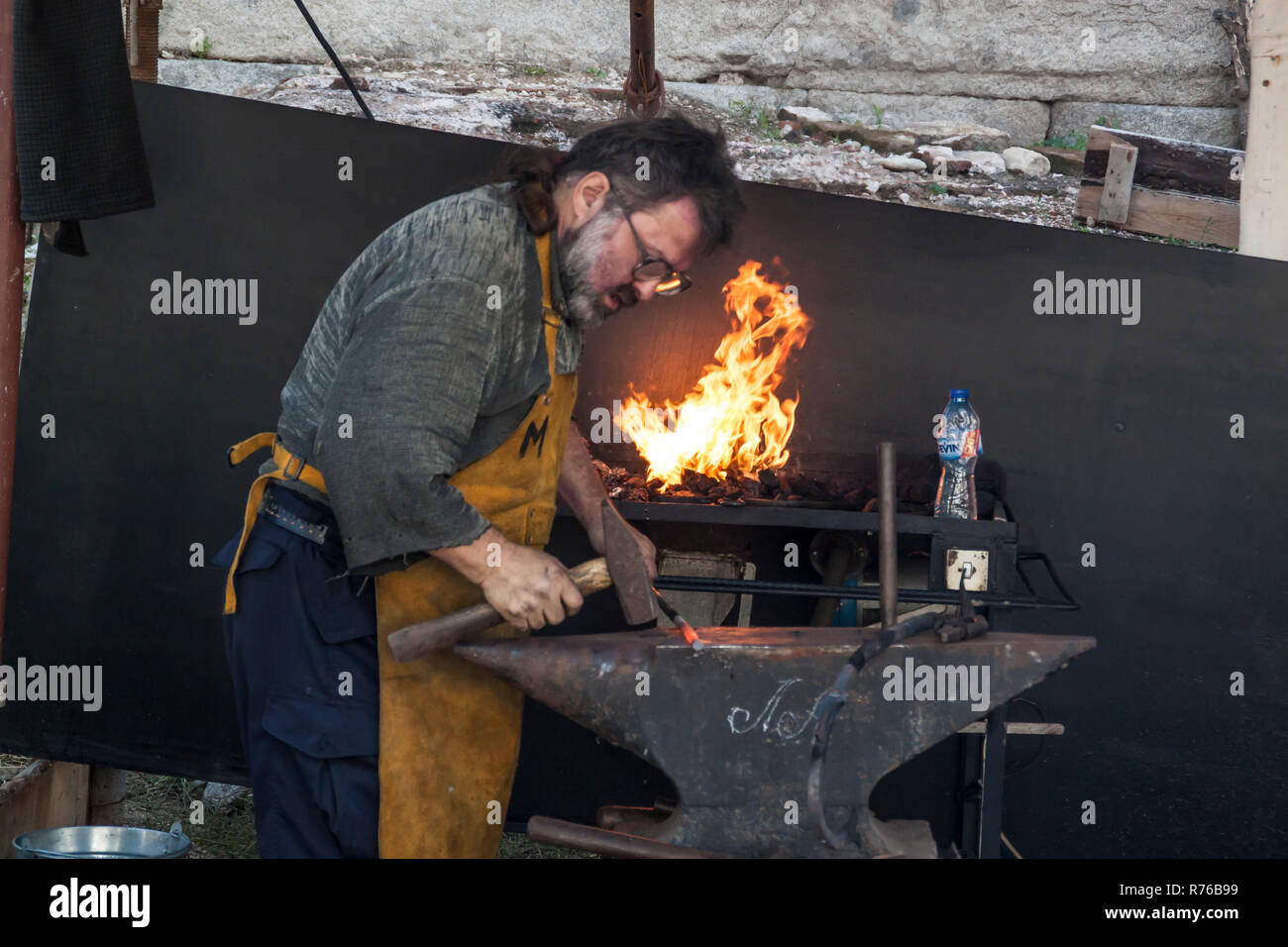 Blacksmith working on his next masterpiece Stock Photo - Alamy