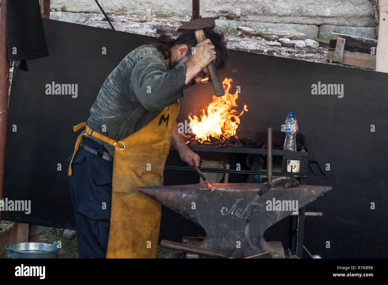 Blacksmith working on his next masterpiece Stock Photo - Alamy