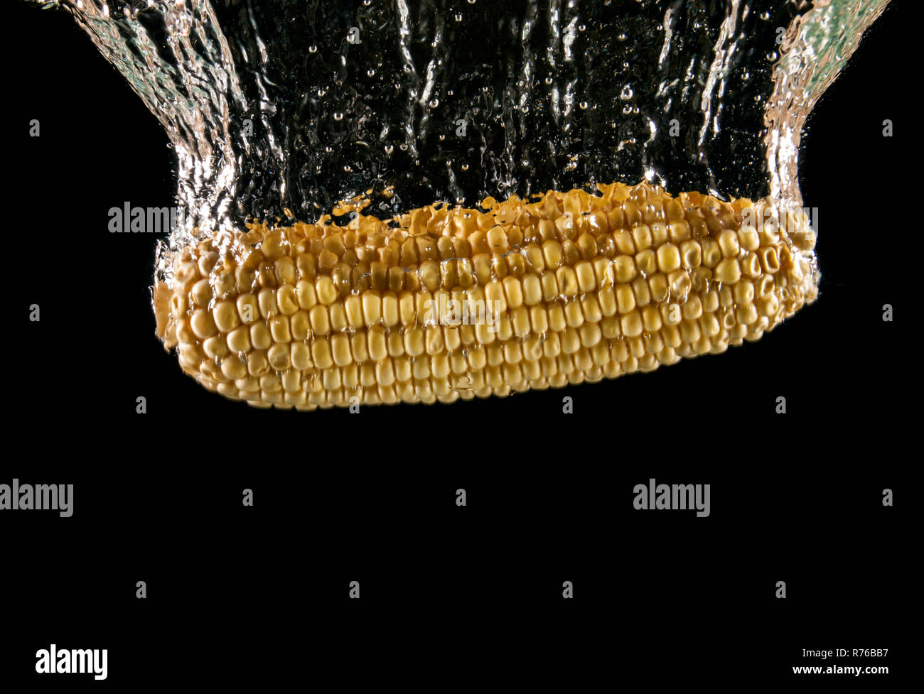 Corn on the cob sinking underwater Stock Photo - Alamy