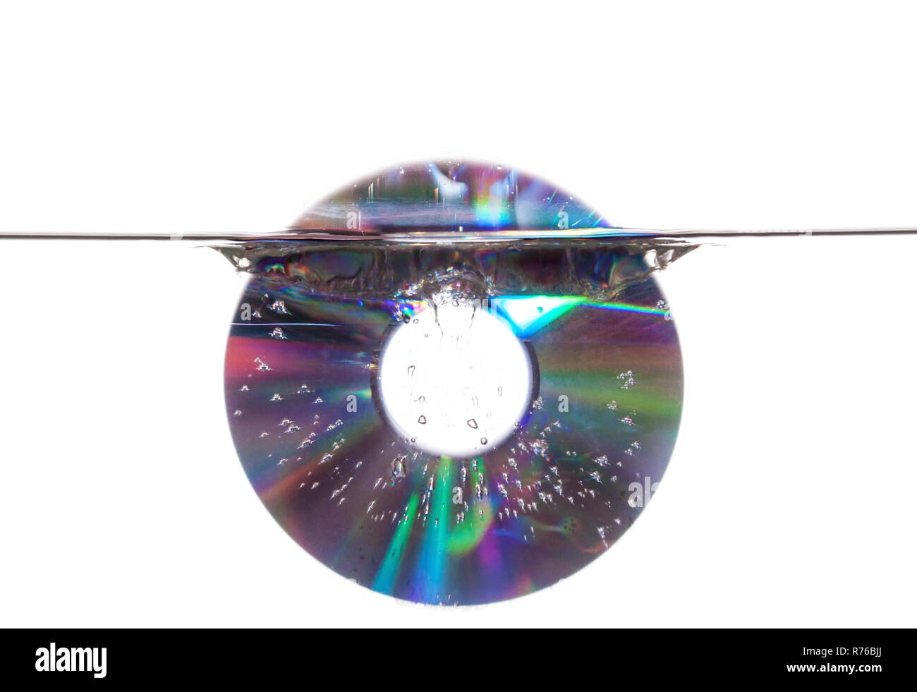 Compact disk sinking in water Stock Photo - Alamy