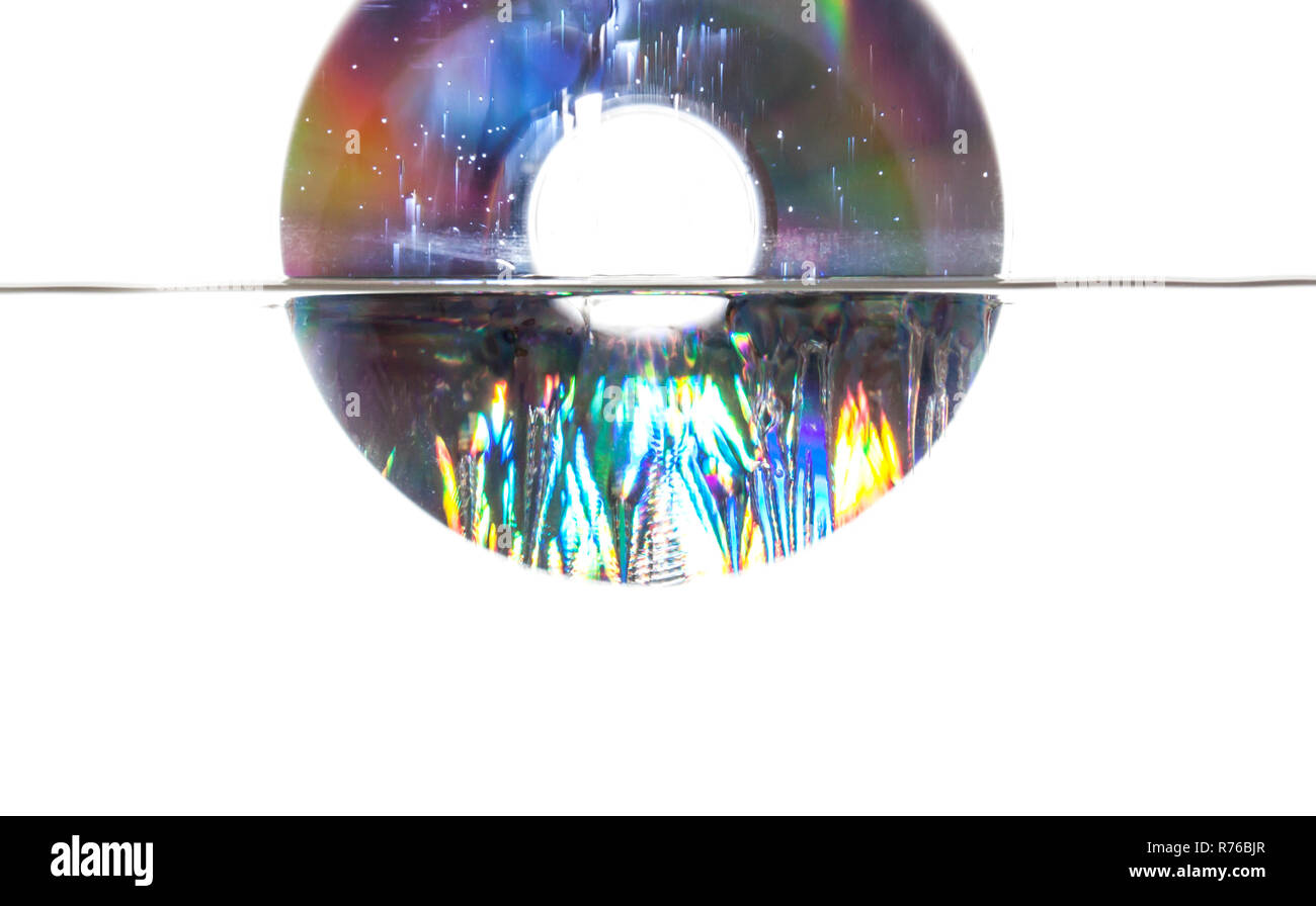 Compact disk sinking in water Stock Photo - Alamy