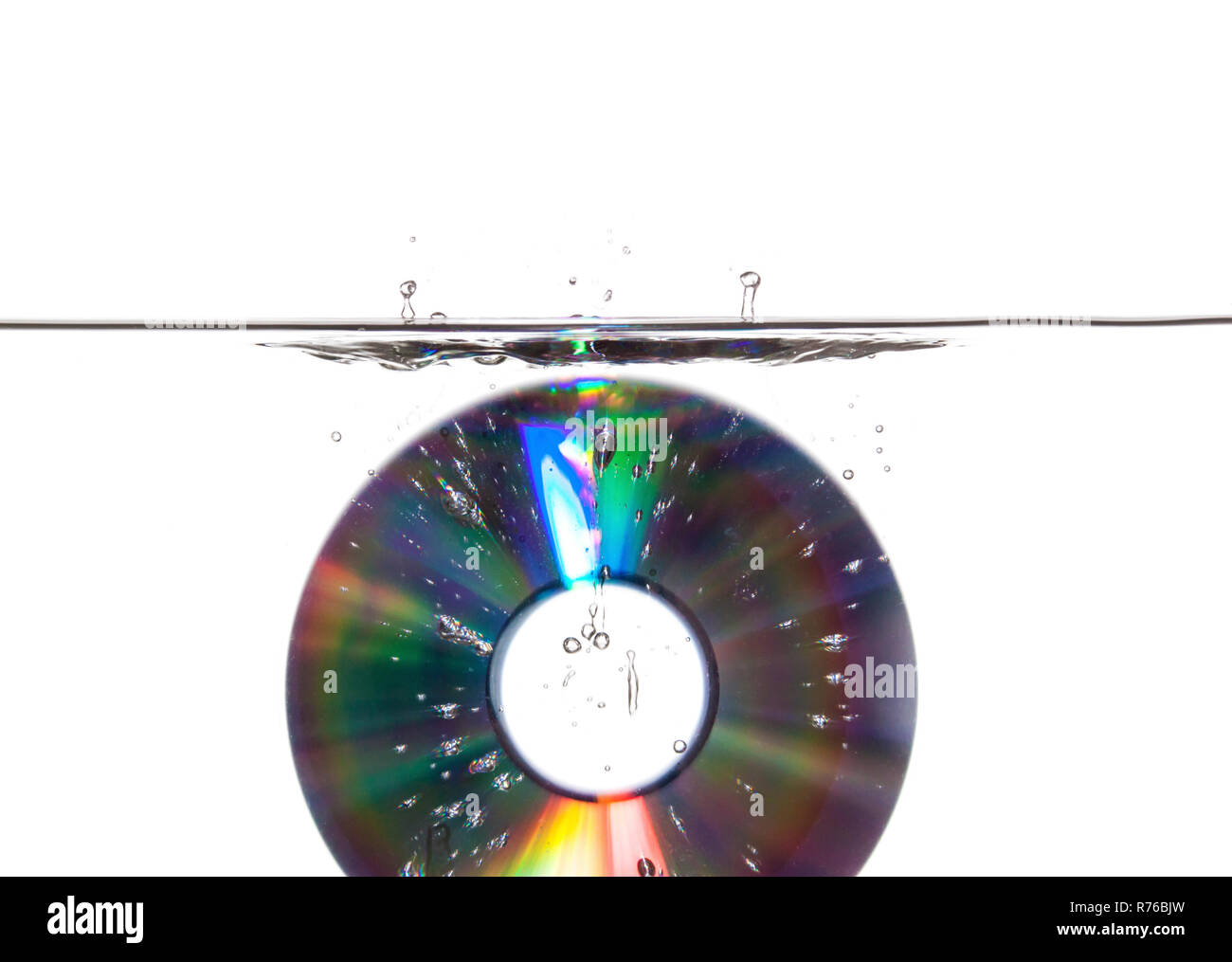 Compact disk sinking in water Stock Photo - Alamy
