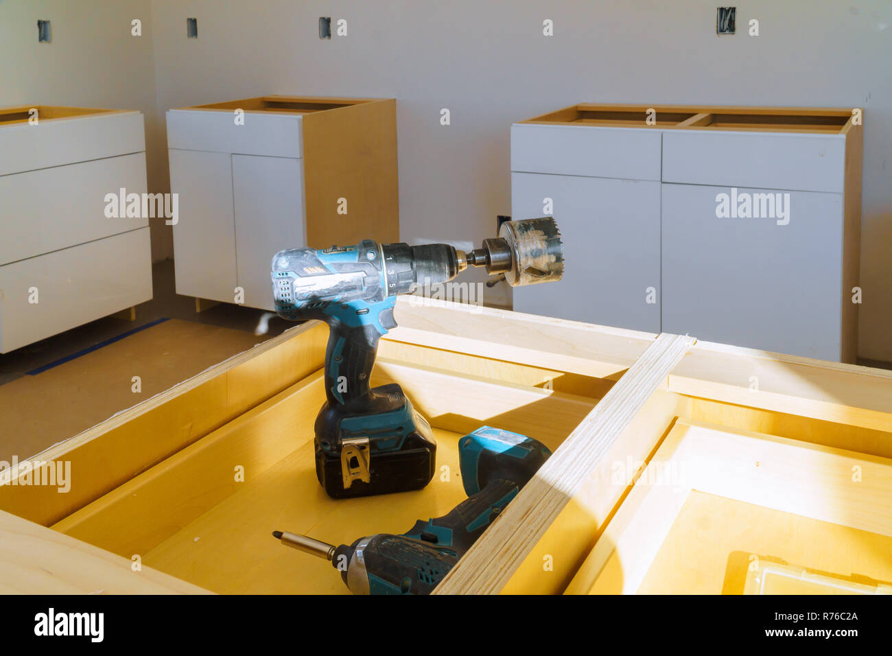 Installing new induction hob in modern kitchen kitchen Installation of ...