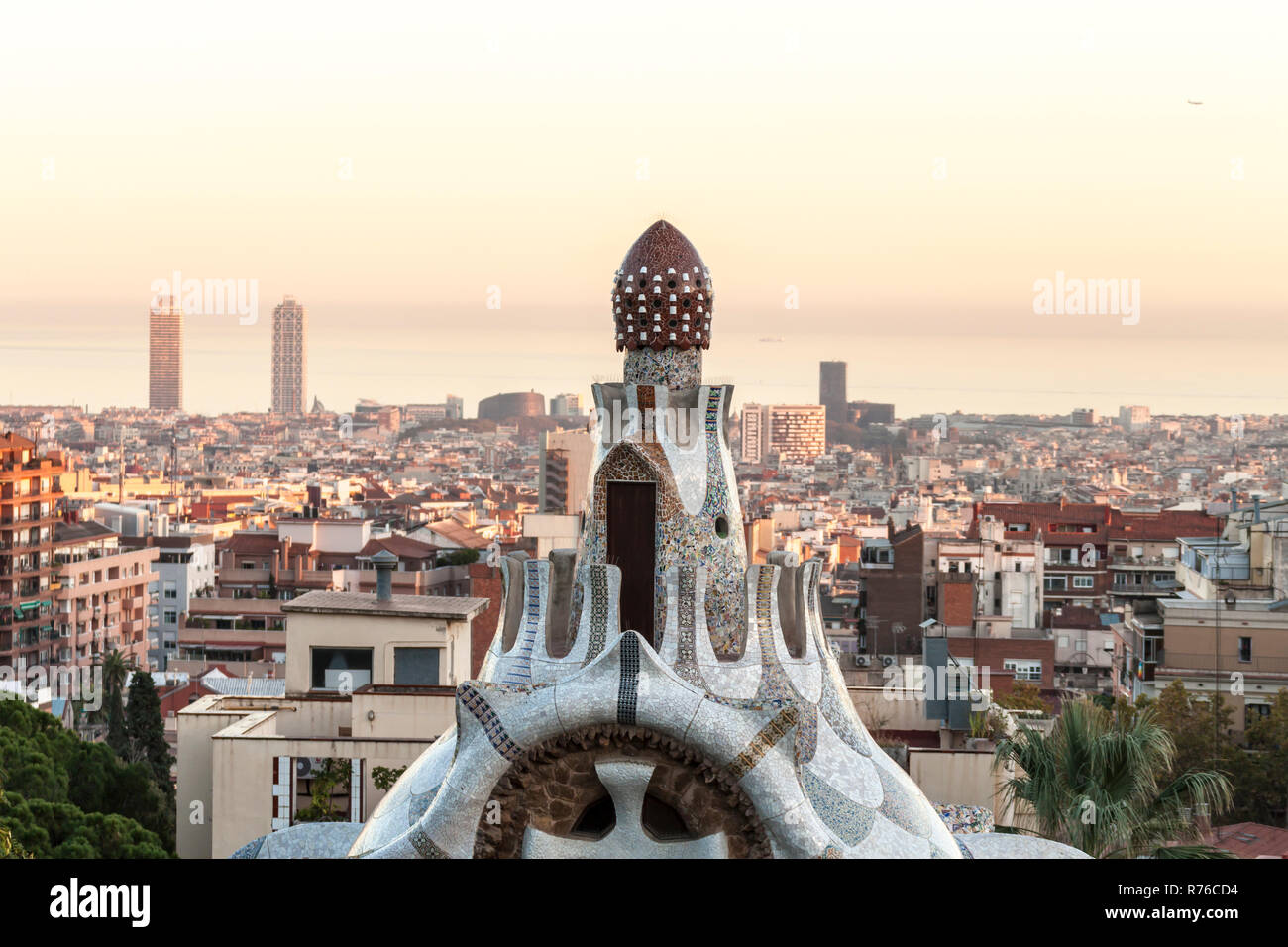 Barcelona city view from above with a Gaudi tower in the foreground ...
