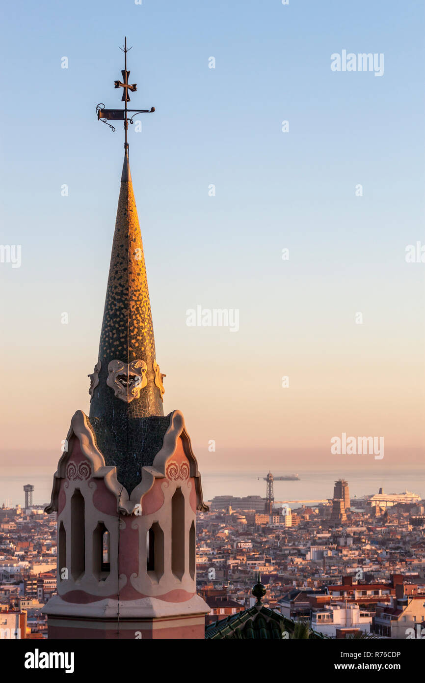 Barcelona city view from above with a Gaudi tower in the foreground ...