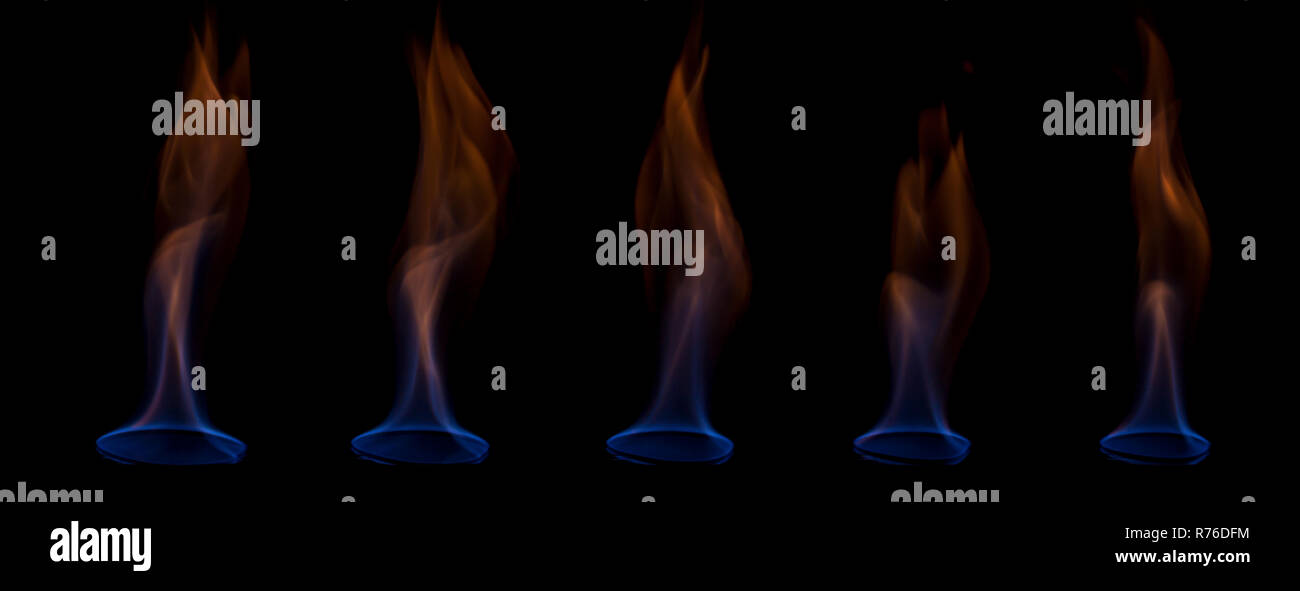 Blue and yellow colored flames isolated on black background Stock Photo ...