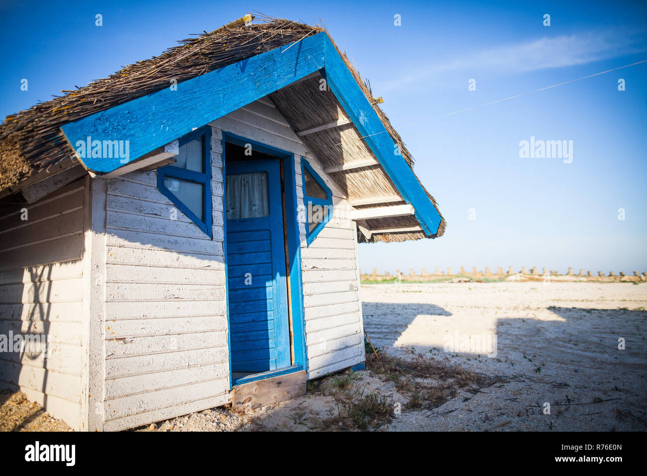 White and blue painted hut Stock Photo - Alamy