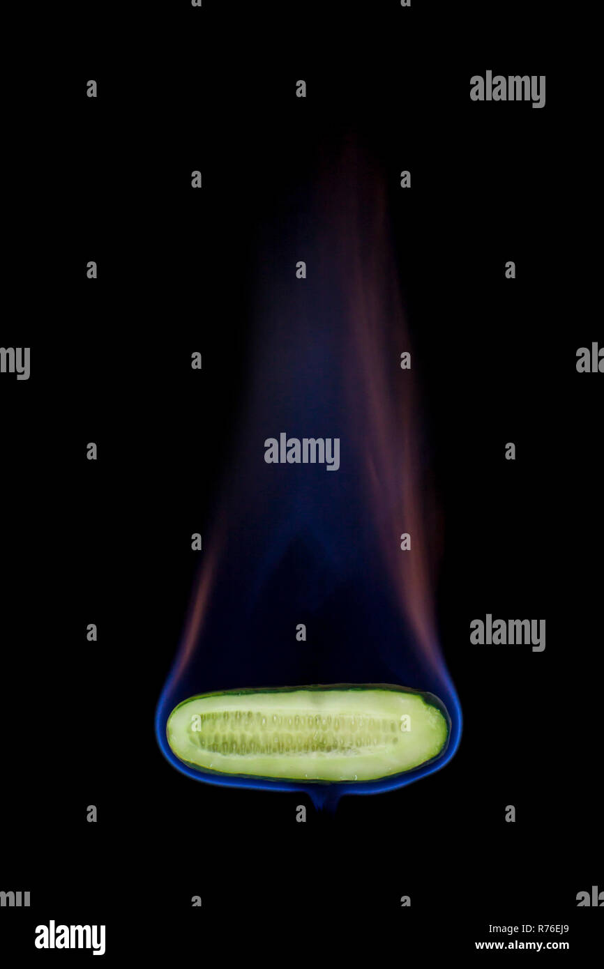 Cucumber on fire with blue flames isolated on black background Stock ...