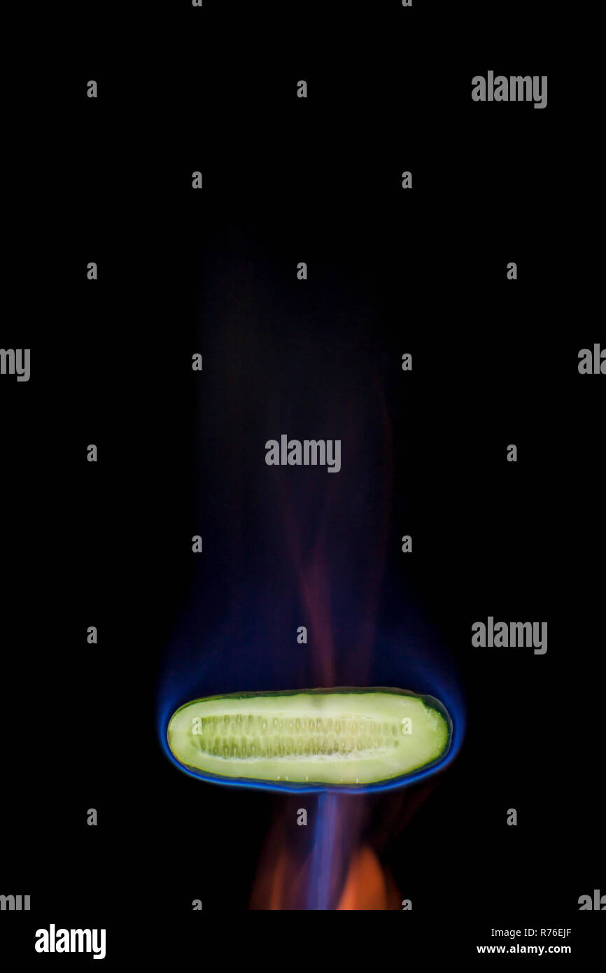 Cucumber on fire with blue flames isolated on black background Stock ...