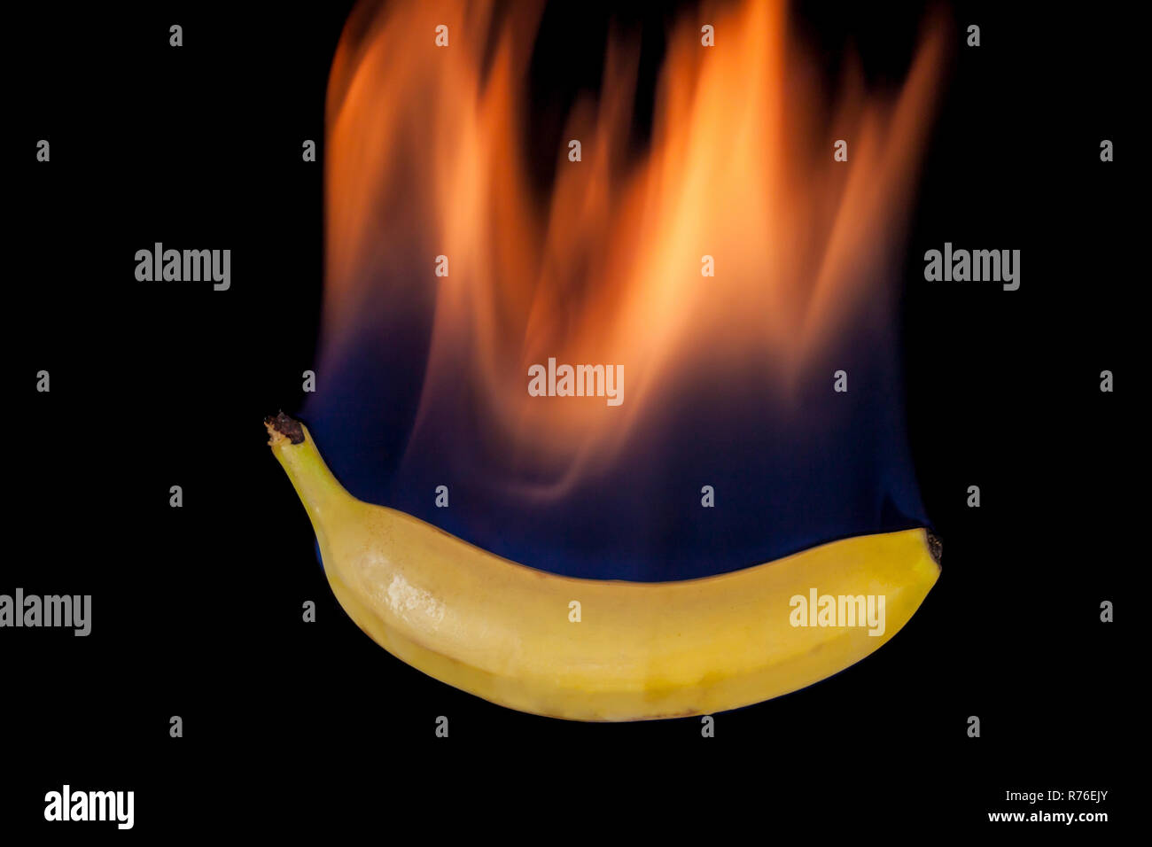 Banana on fire with blue flames isolated on black background Stock ...