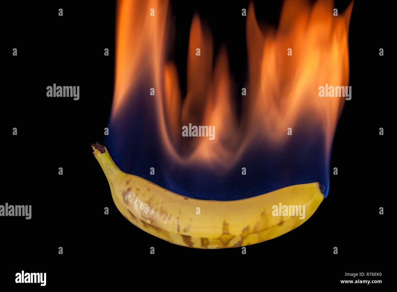 Banana on fire with blue flames isolated on black background Stock ...