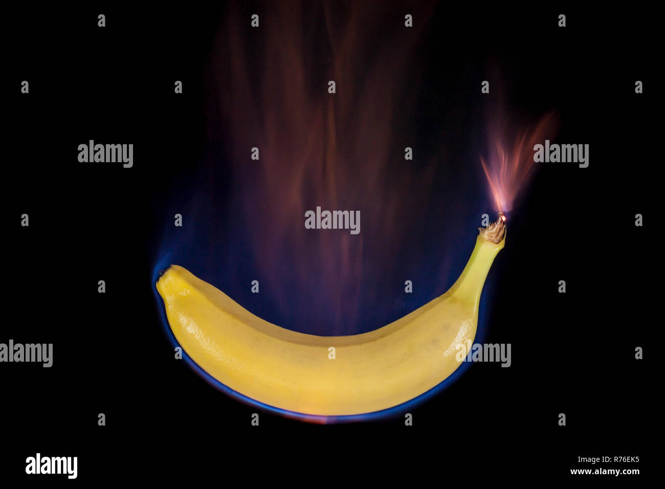 Banana on fire with blue flames isolated on black background Stock ...