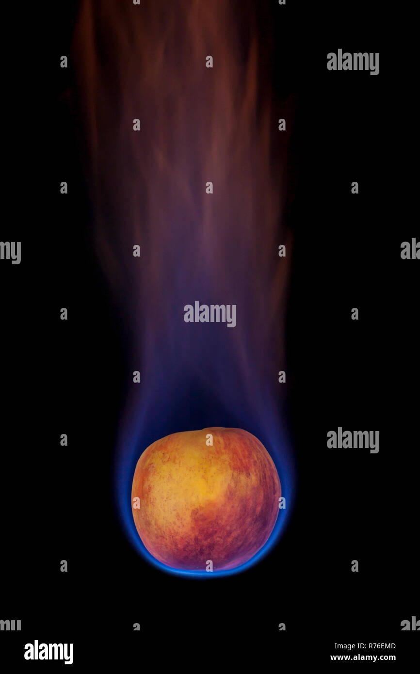 Peach on fire with blue flames isolated on black background Stock Photo ...