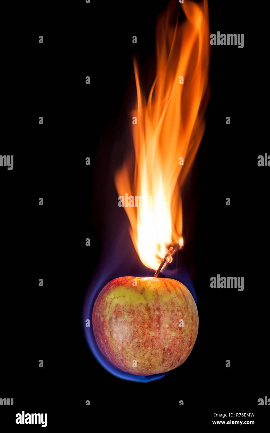 Apple on fire with blue flames isolated on black background Stock Photo ...