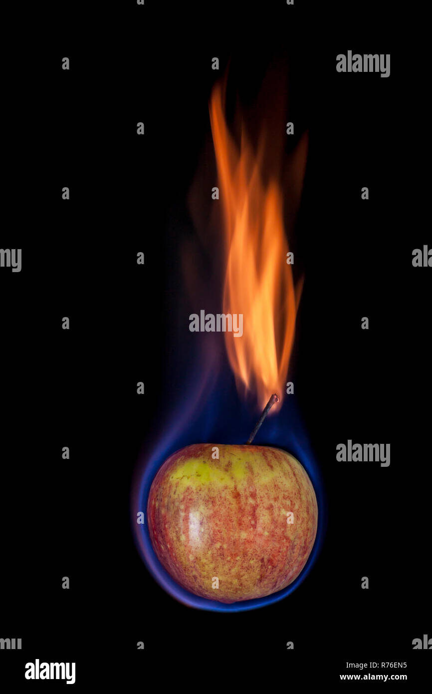 Apple on fire with blue flames isolated on black background Stock Photo ...