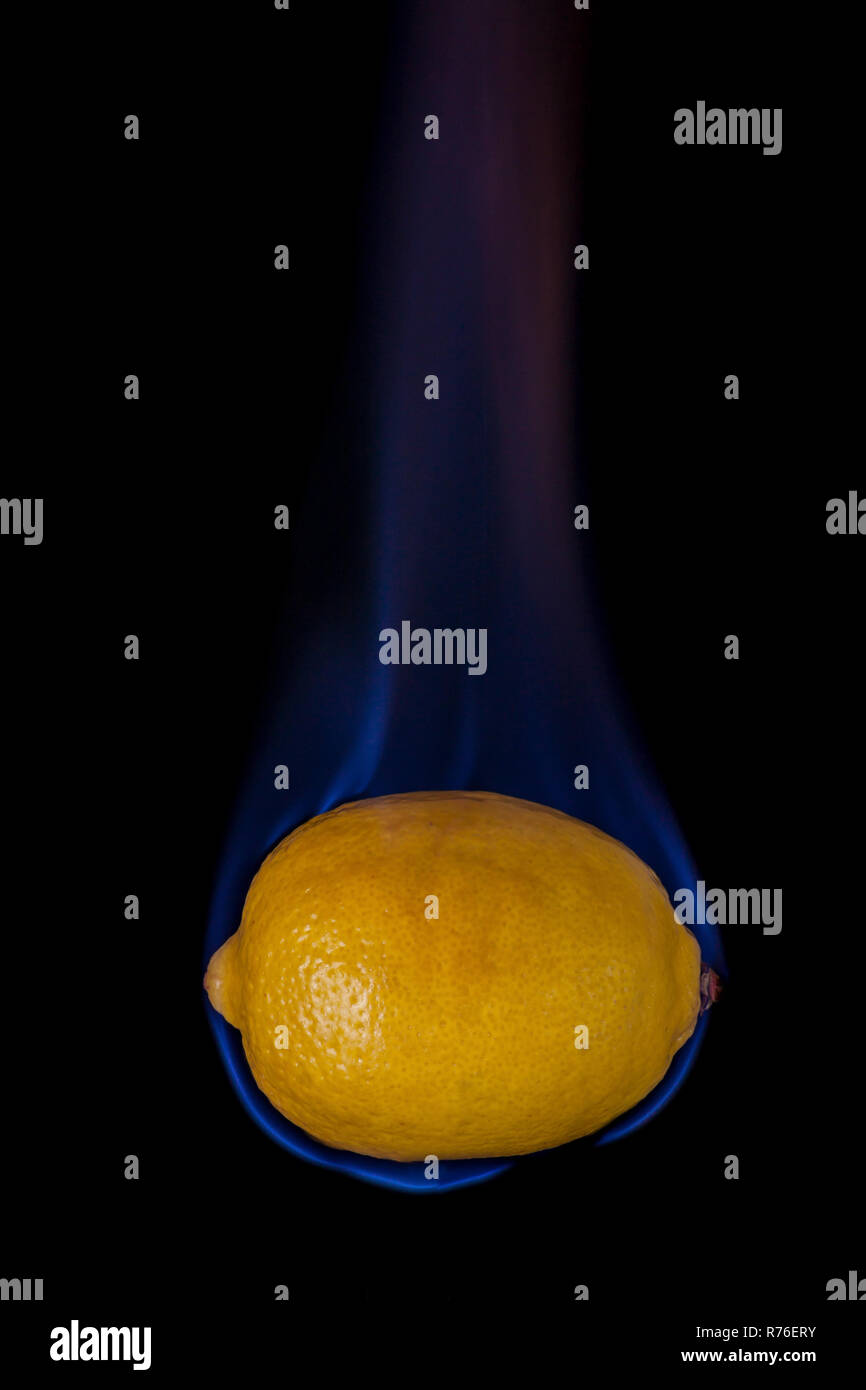 Lemon ot fire with blue flames isolated on black background Stock Photo ...