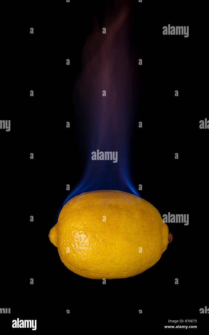 Lemon ot fire with blue flames isolated on black background Stock Photo ...