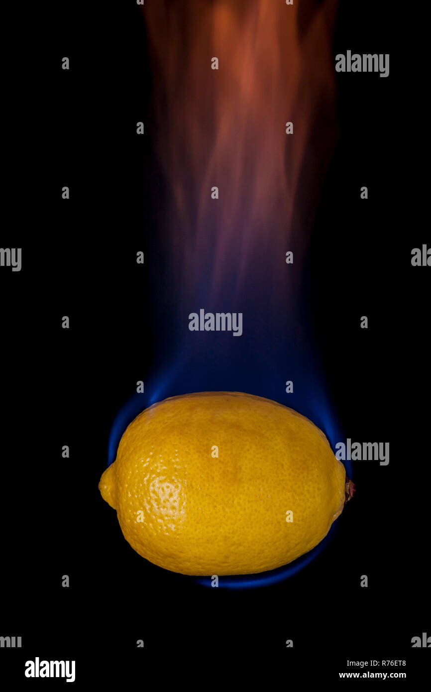 Lemon ot fire with blue flames isolated on black background Stock Photo ...