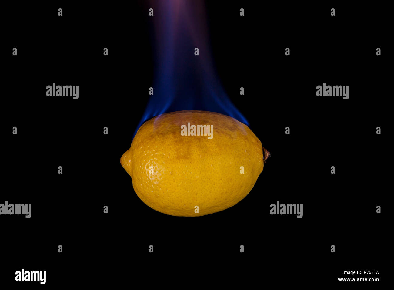 Lemon ot fire with blue flames isolated on black background Stock Photo ...