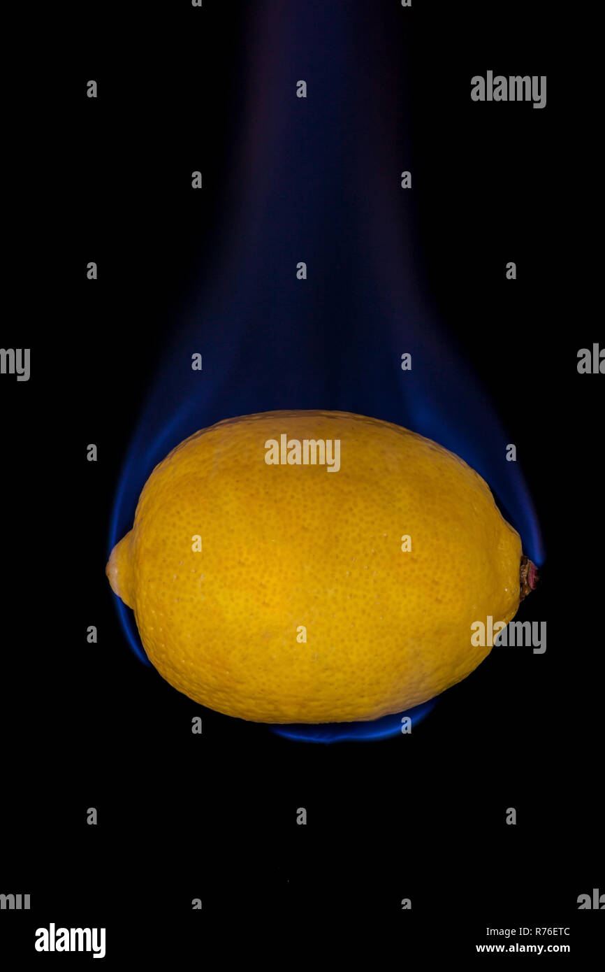 Lemon ot fire with blue flames isolated on black background Stock Photo ...