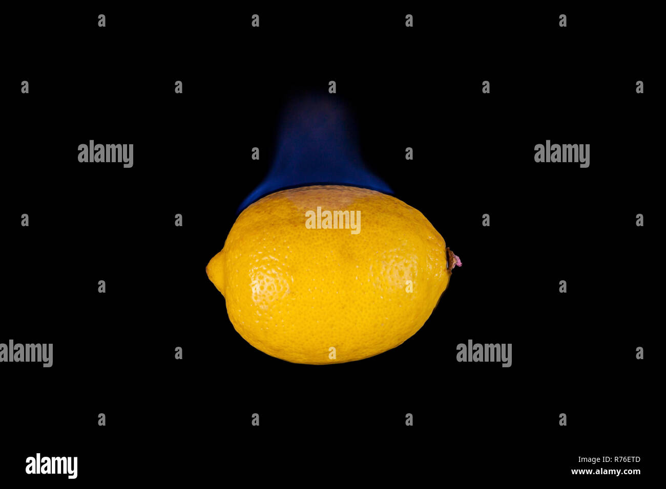 Lemon ot fire with blue flames isolated on black background Stock Photo ...