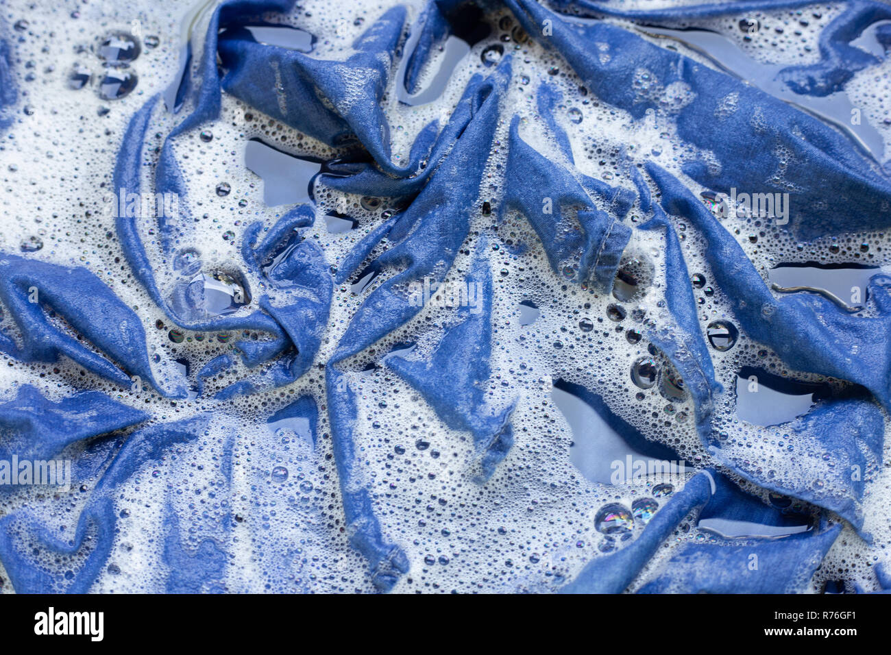 Washing Jeans shirt, soaked Stock Photo - Alamy