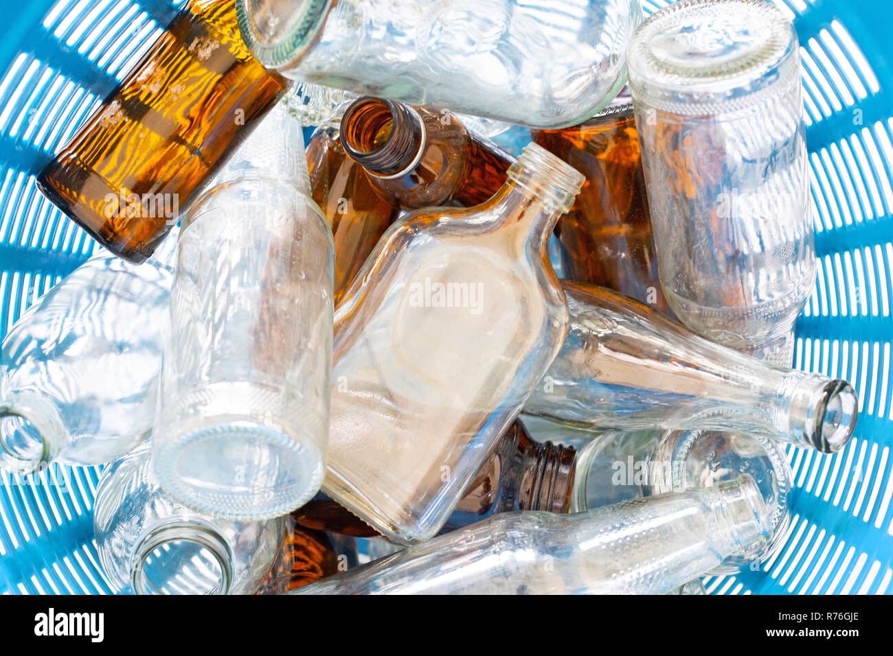 Glass bottles in waste basket Stock Photo - Alamy